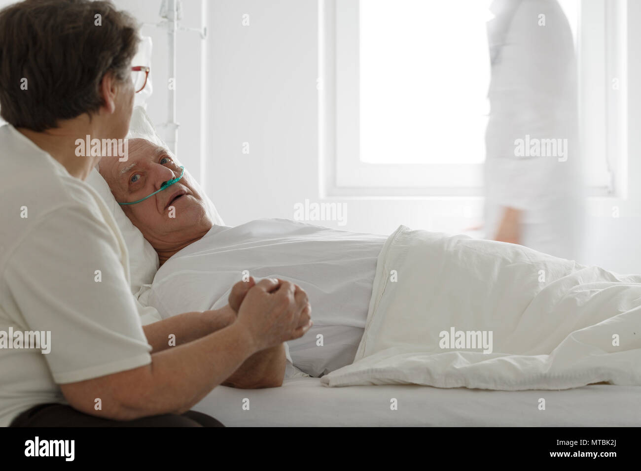 Dying man bed family hi-res stock photography and images - Alamy