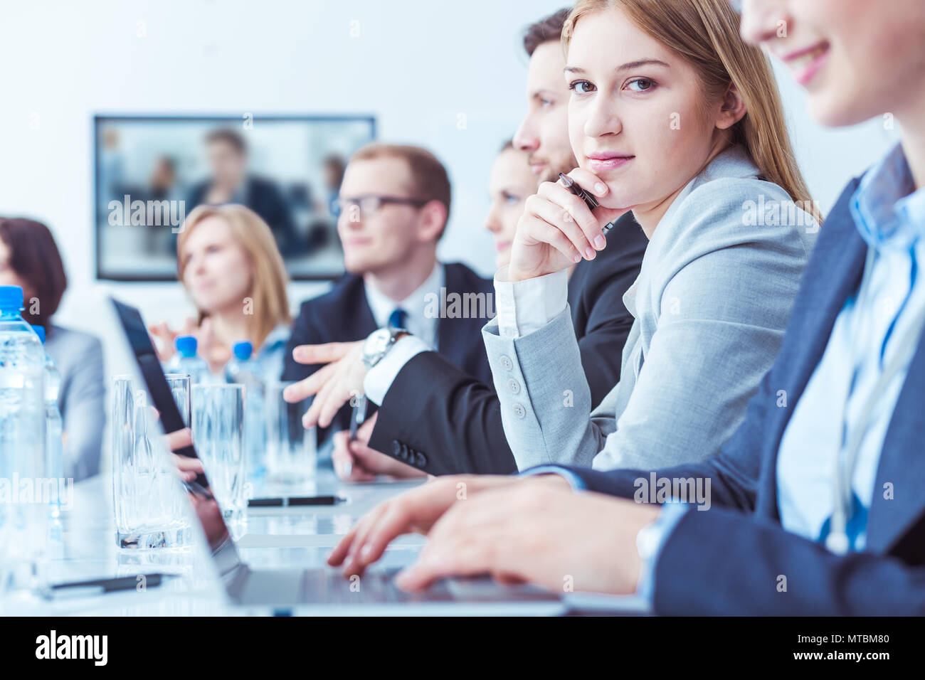 Elegant business partners during video conference, sitting in light ...