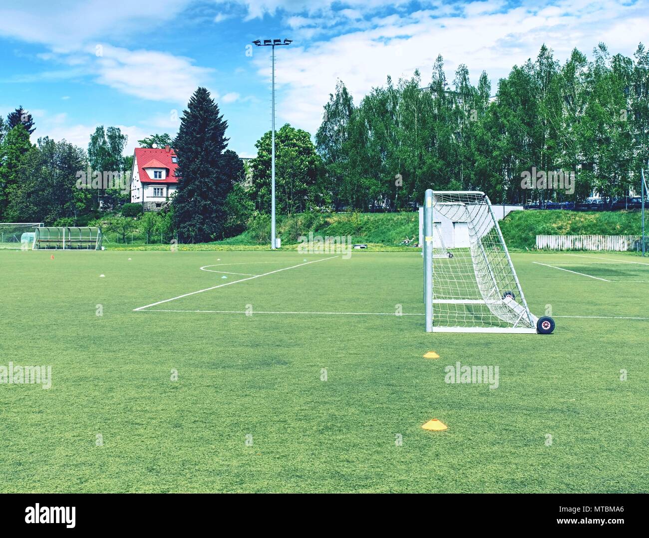 Football playground. Gate with blue yellow nets, soccer football net ...
