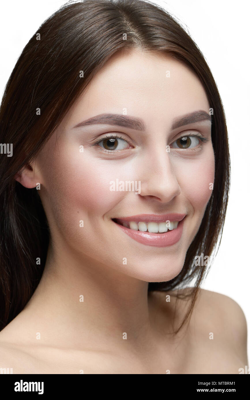 Close up of a girl with light day make up looking at camera. model ...