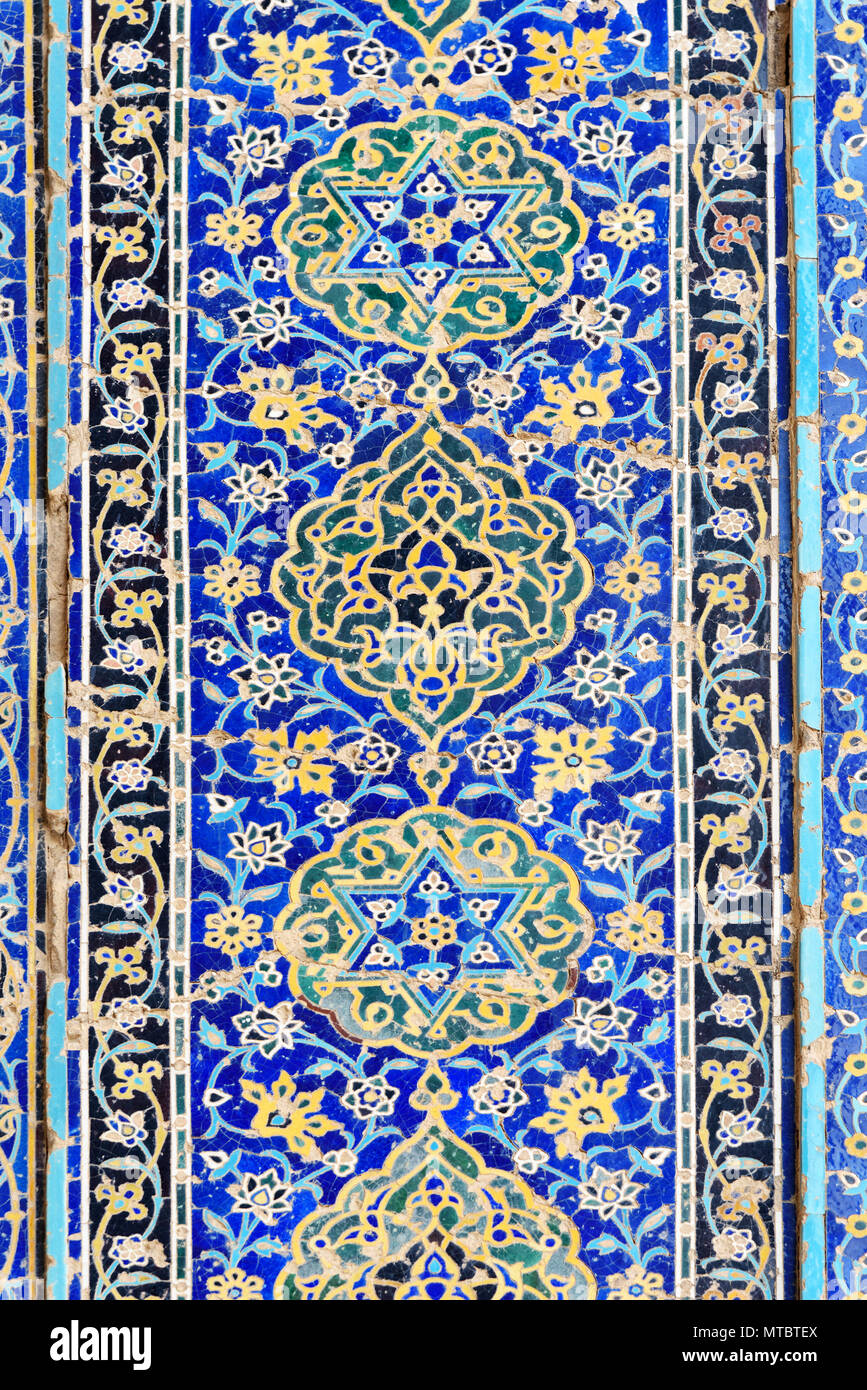 Remains of the decorated blue mosaic tiles on the wall of entrance to ...