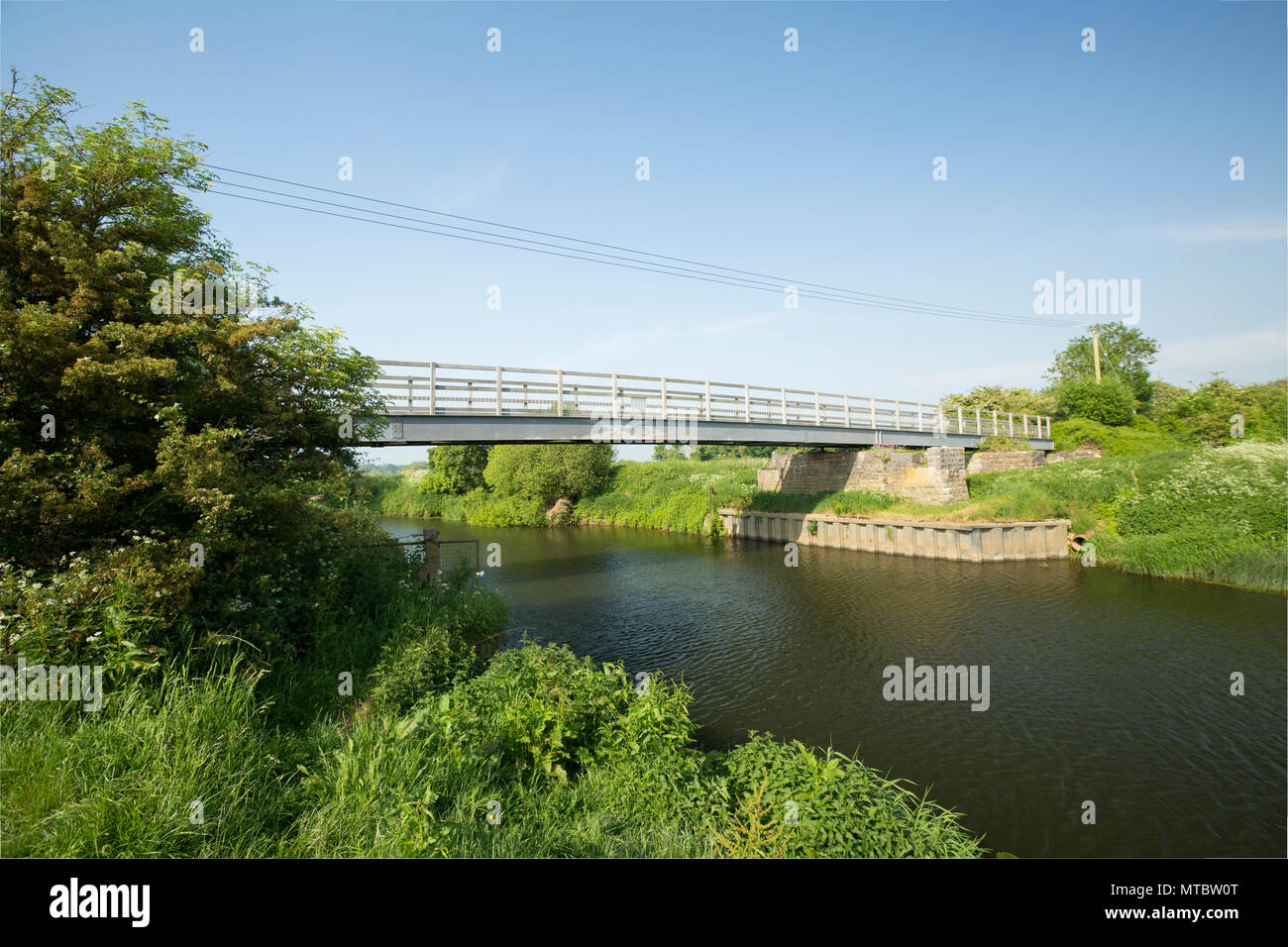A bridge over the Dorset Stour river downstream of Fiddleford Mill near ...