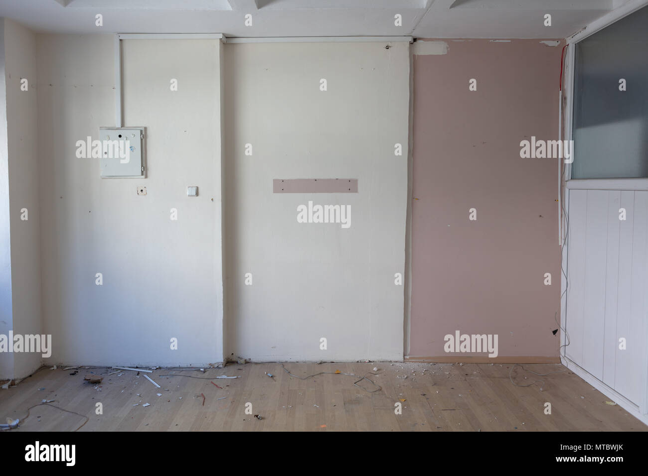 inside of an Unfinished refurbishing room with metal separate panel and ...