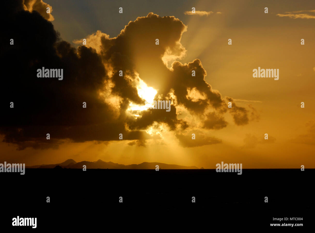 Setting sun seen from ocean liner approaching St Maarten, Caribbean ...