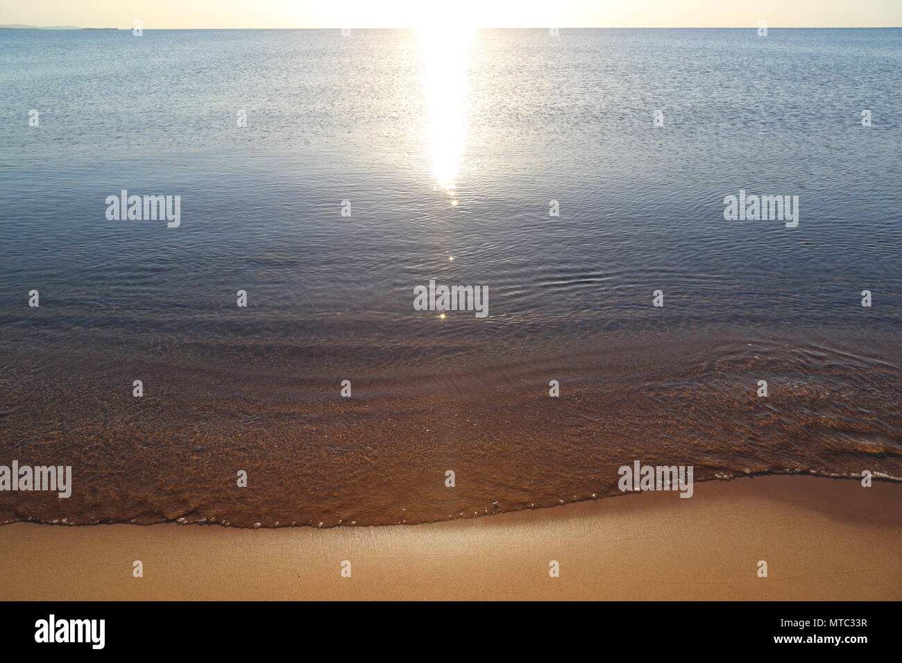 Shore beach sunrise calm sea hi-res stock photography and images - Alamy