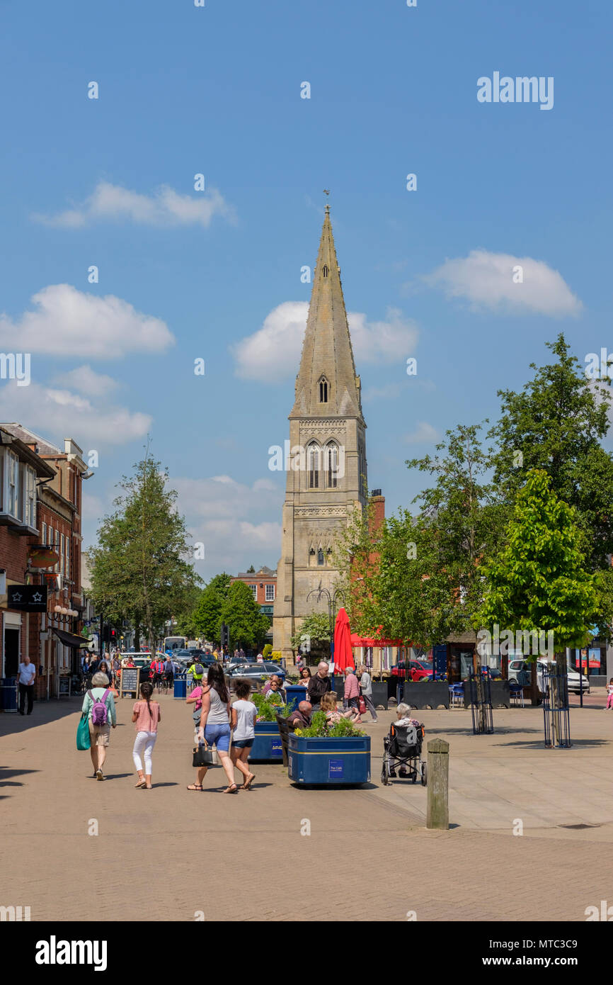 People enjoying the sun in The Market square Market Harborough, a ...
