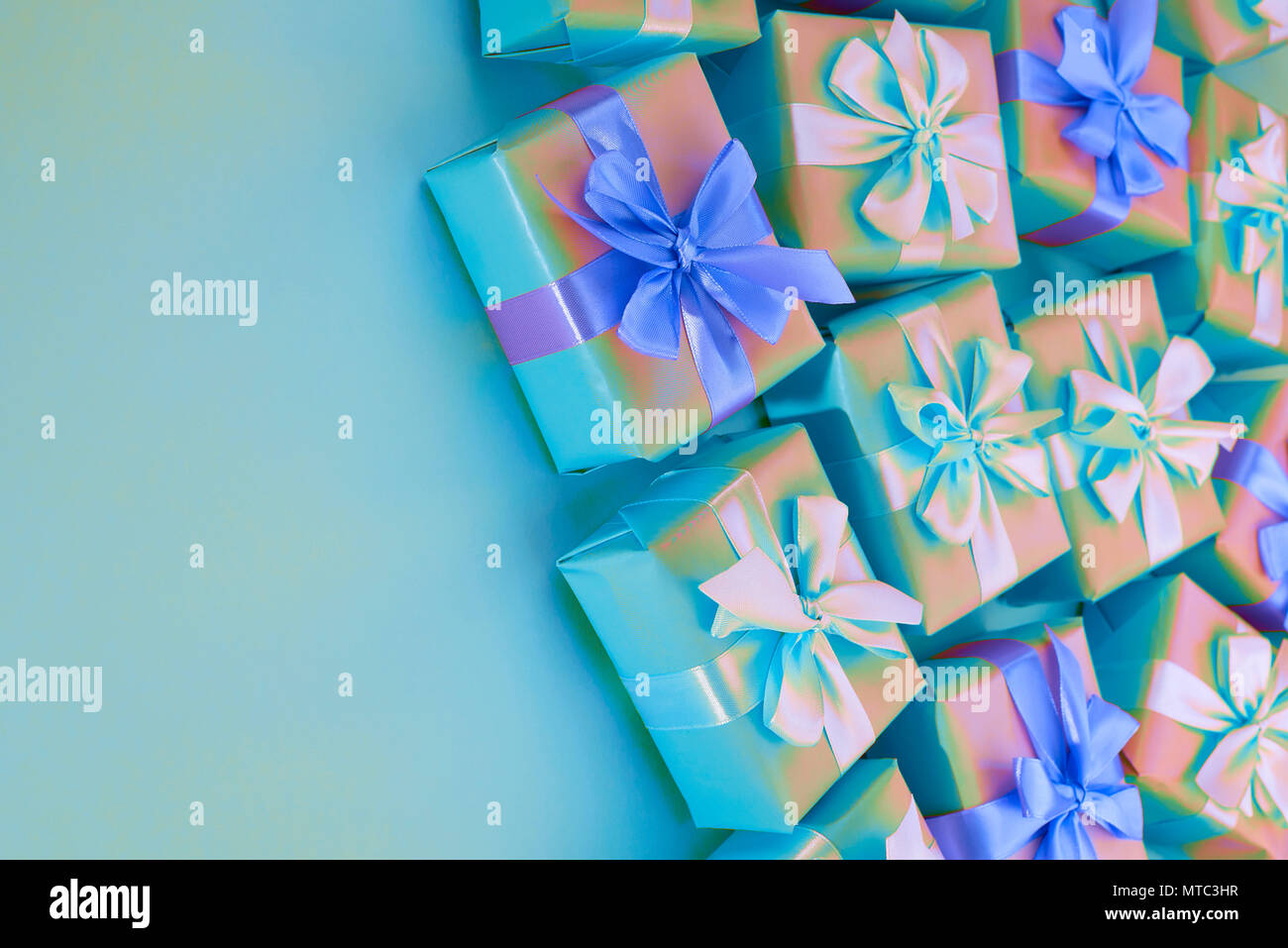 surrealism Decorative holiday gift boxes with pink color on blue ...