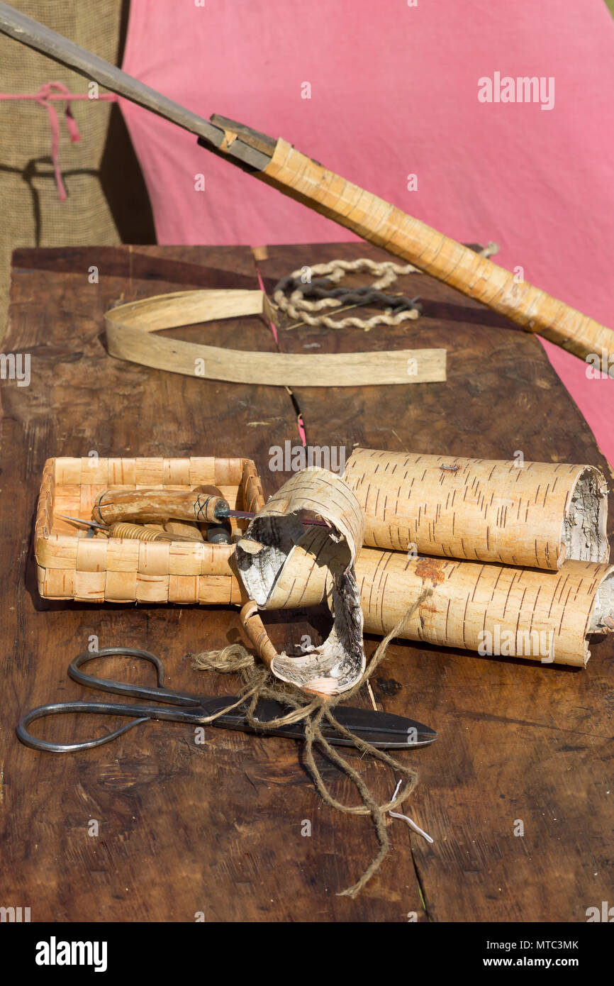 Scissors, rope, awl and birch's bark on wooden table Stock Photo - Alamy