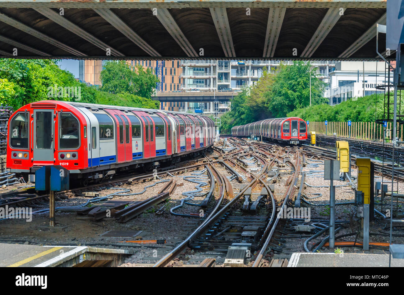Trains arrive at and depart from White City London Underground Station ...