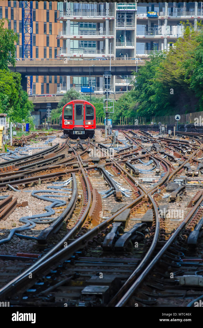 A Trains departs from White City London Underground Station navigating ...