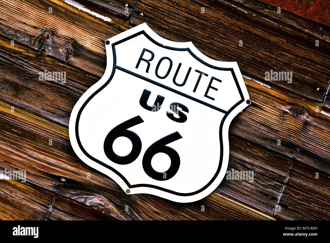 Historic U.S. old Route 66 sign with wooden background Stock Photo - Alamy