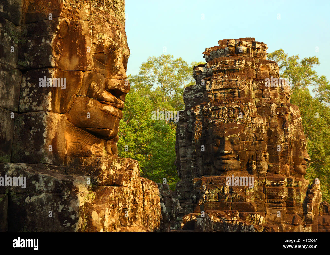 Giant stone faces at Bayon Temple in Cambodia Stock Photo - Alamy