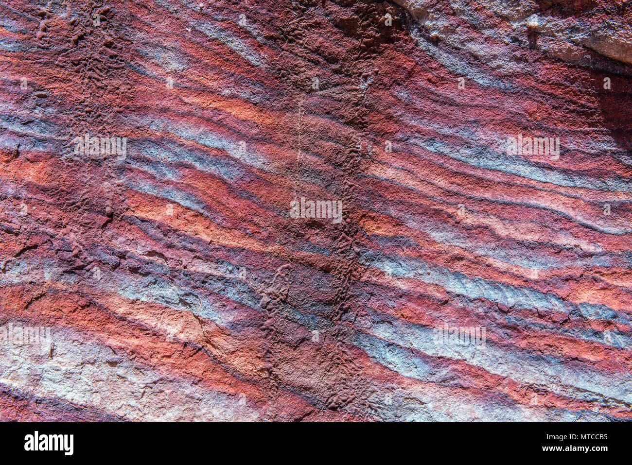 Colorful, red sandstone formation texture. Abstract geological pattern ...