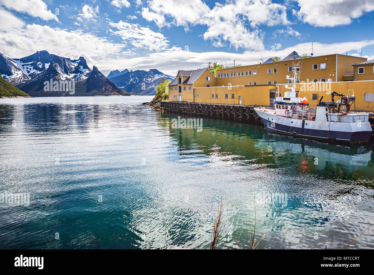 The port of Husoy village on Senja Island beyond the Polar Circle in ...