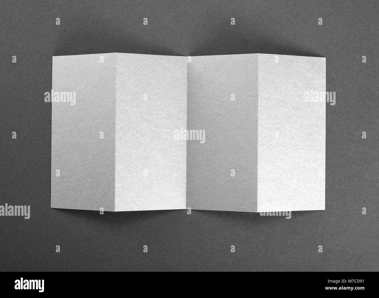 Blank folding page booklet on grey background Stock Photo - Alamy