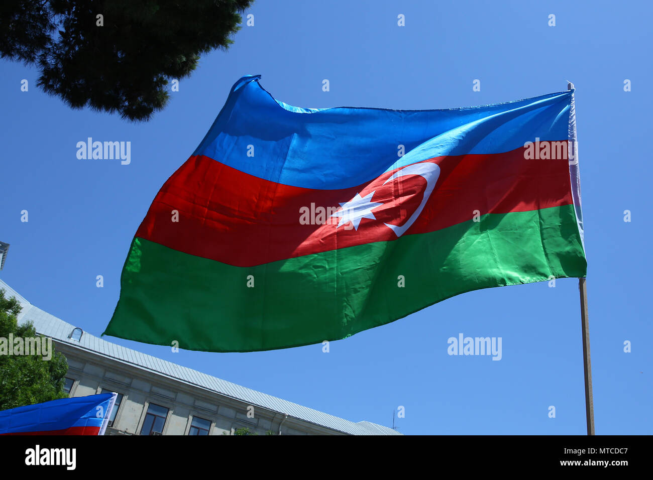 Azerbaijan flag in Baku, Azerbaijan. National sign background. Red ...