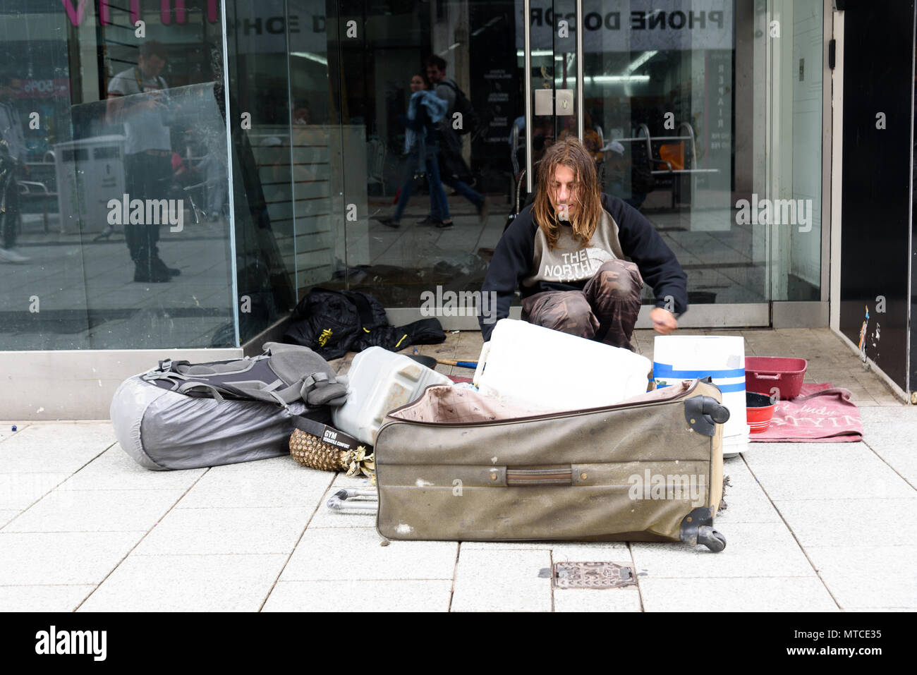 Cardiff, Wales, UK, May 27, 2018: Homeless Person performing drum music ...
