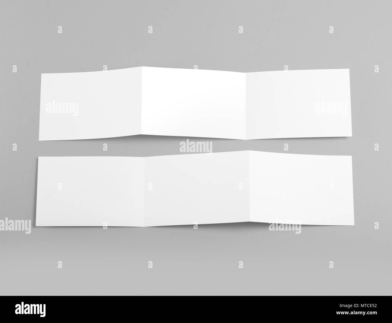Blank folding page booklet on grey background Stock Photo - Alamy
