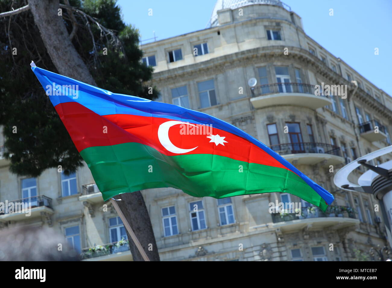 Azerbaijan flag in Baku, Azerbaijan. National sign background. Red ...