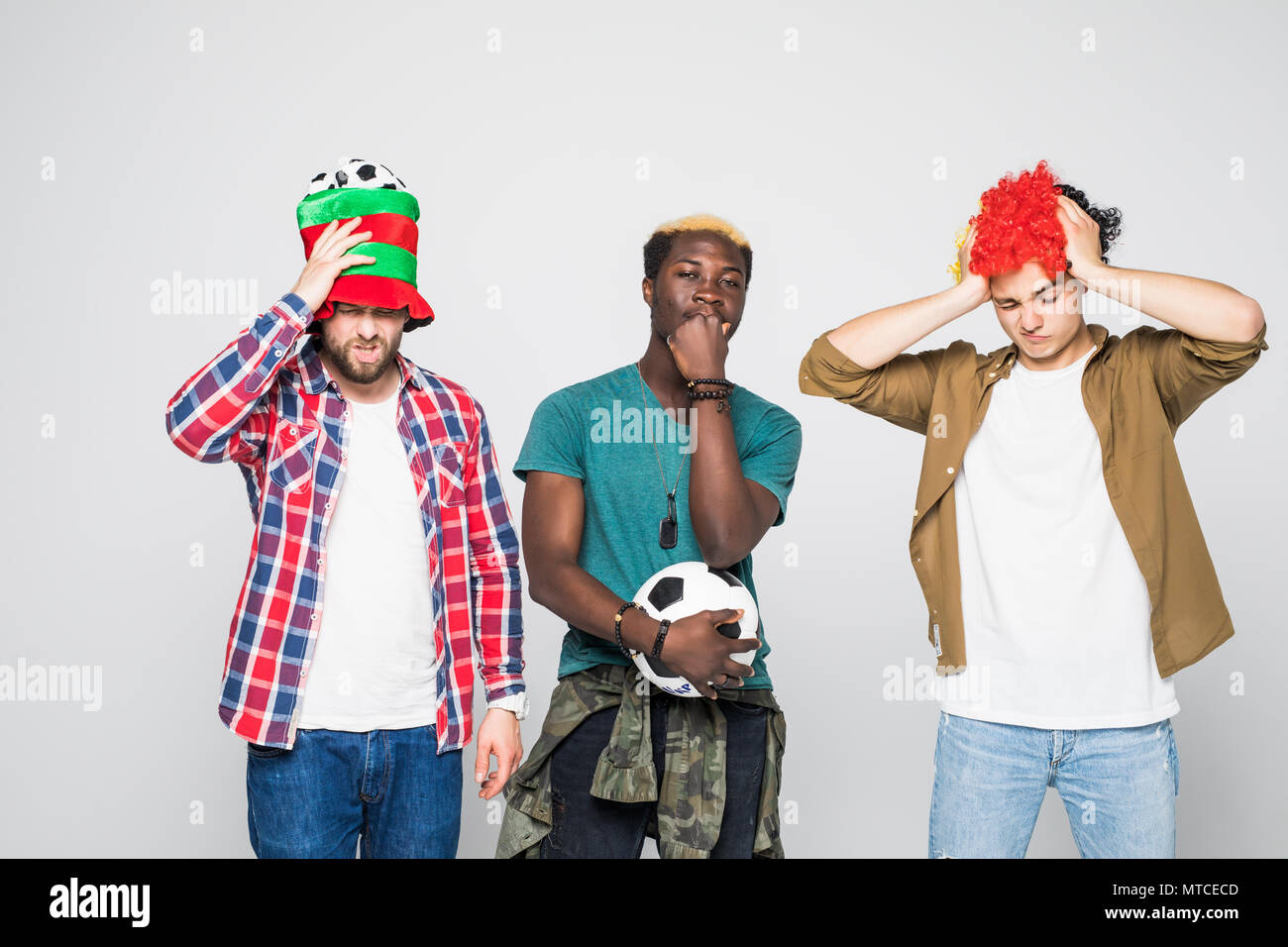 Group of very sad football fans isolated on white background Stock ...