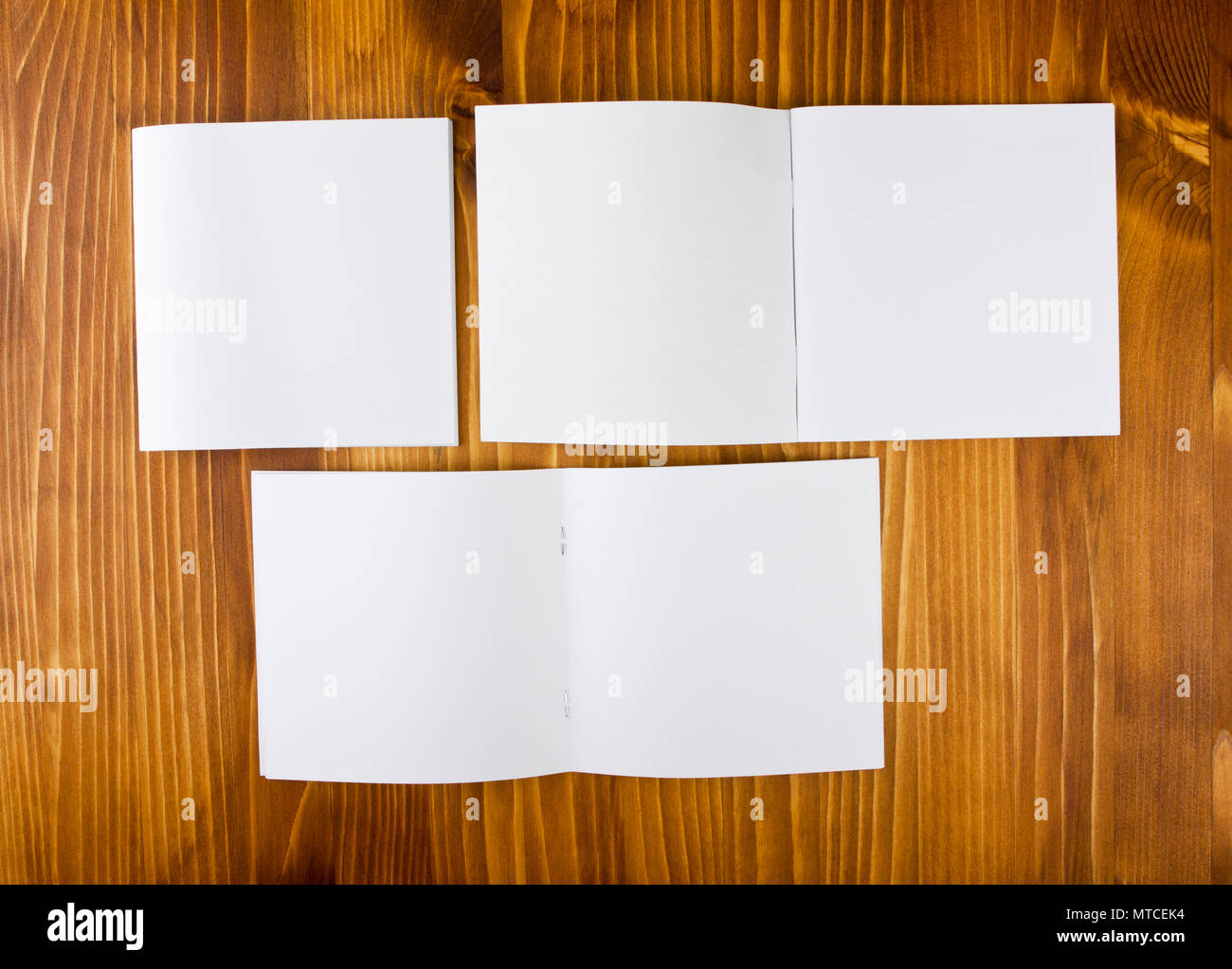 Blank catalog, brochure, book mock up. Empty opened magazine on wooden ...