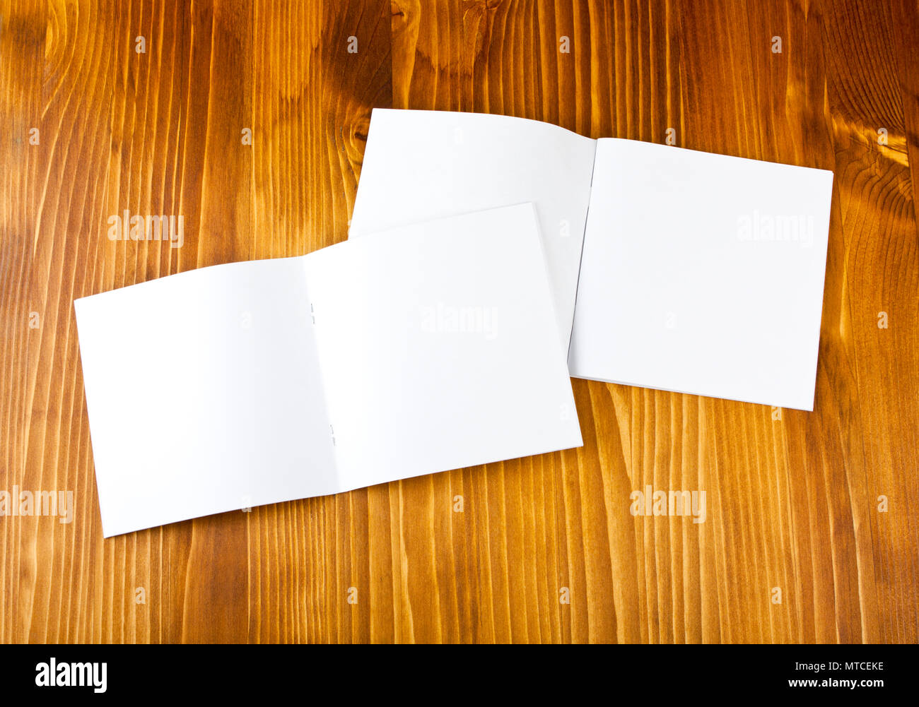 Blank catalog, brochure, book mock up. Empty opened magazine on wooden ...