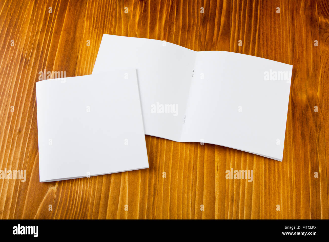 Blank catalog, brochure, book mock up. Empty opened magazine on wooden ...