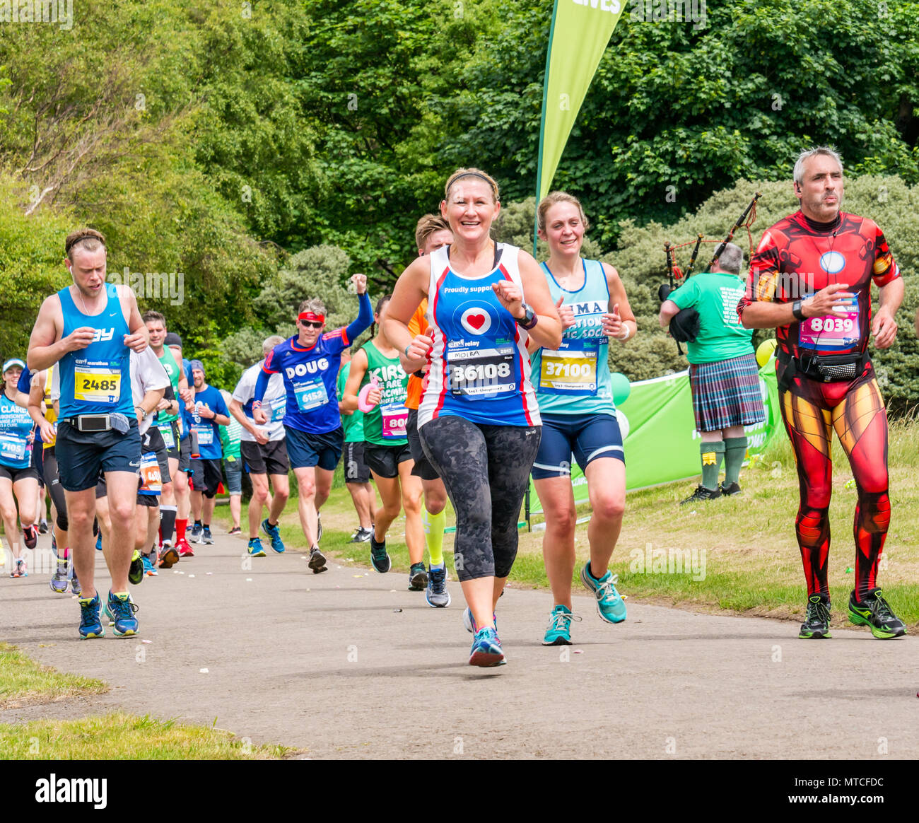 Male female athletes running marathon race hi-res stock photography and ...