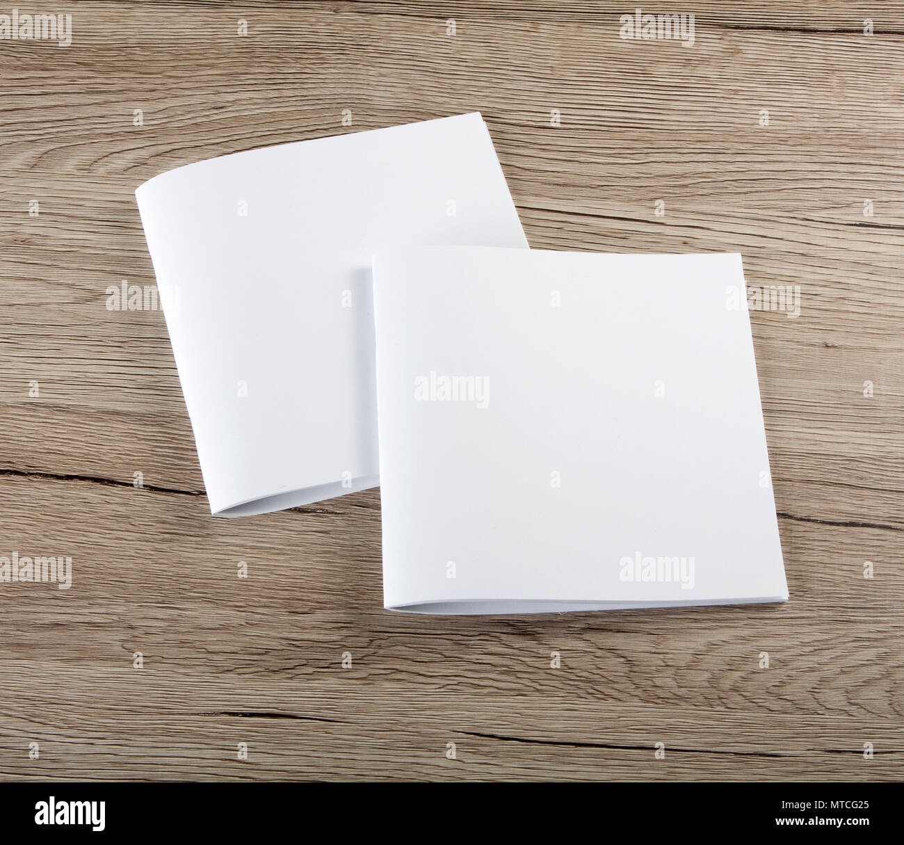 Blank Brochure magazine on wooden background to replace your design ...