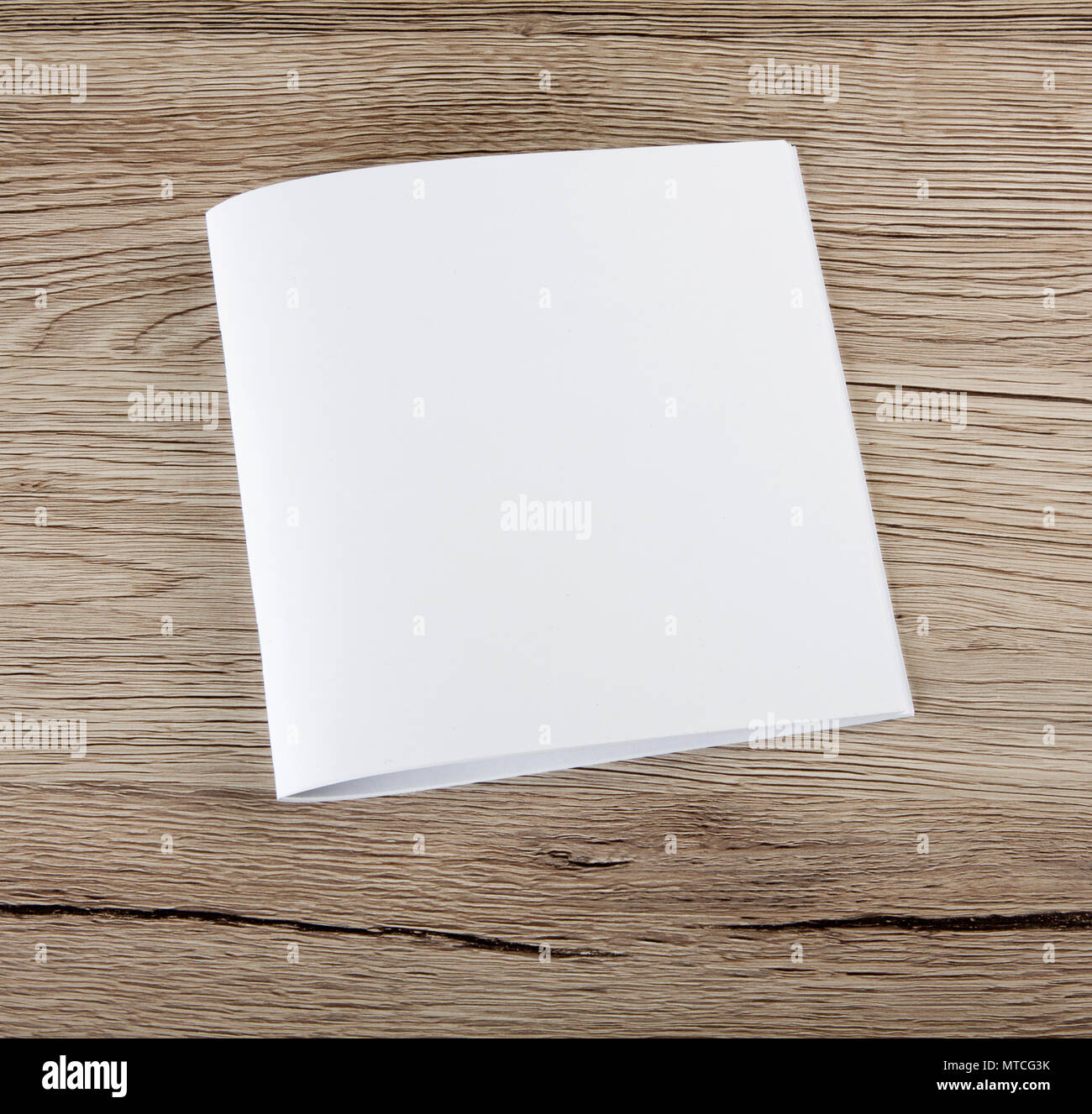 Blank Brochure magazine on wooden background to replace your design ...