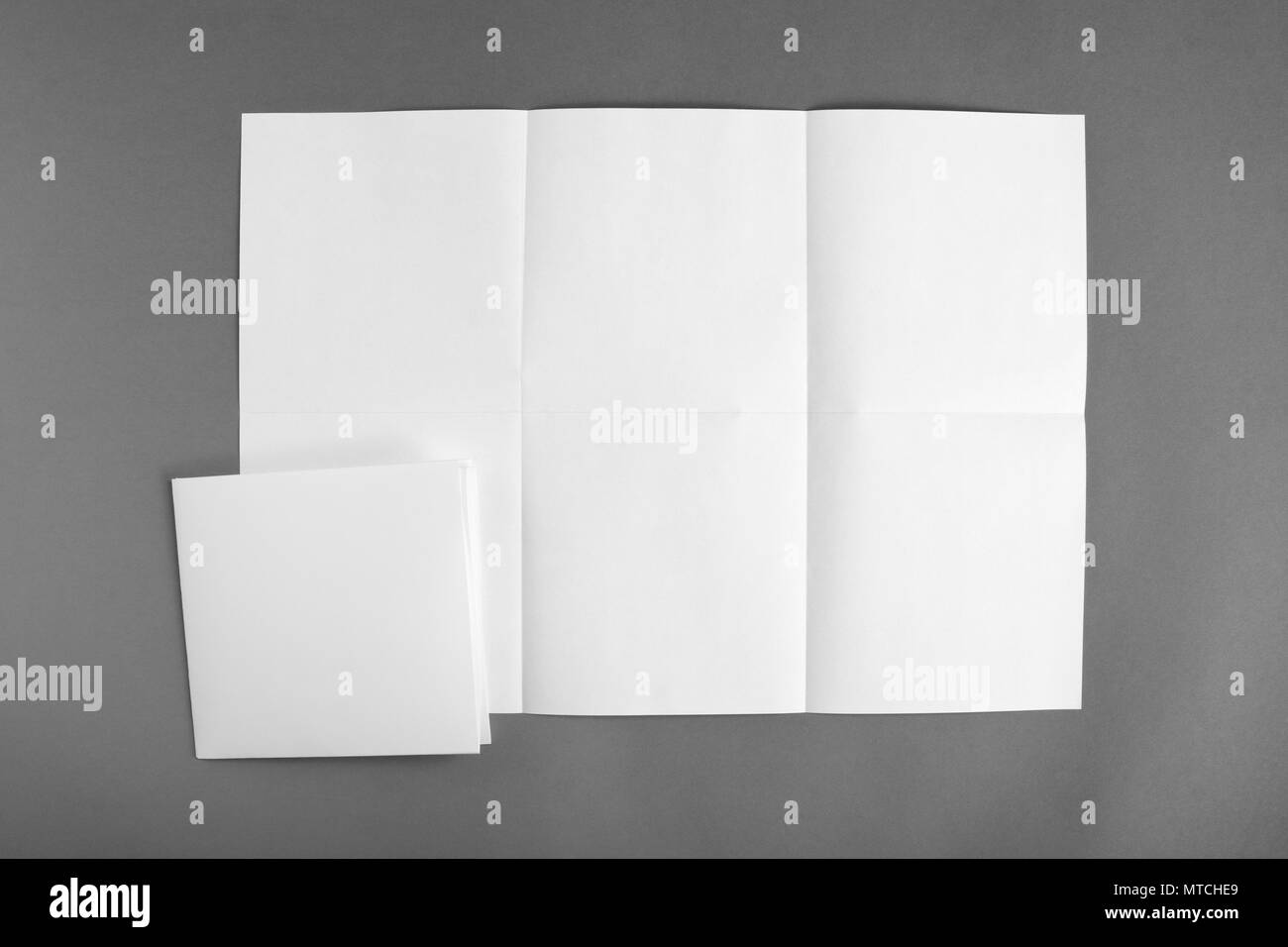 Close up of a crumpled unfolded piece of paper on gray background Stock ...