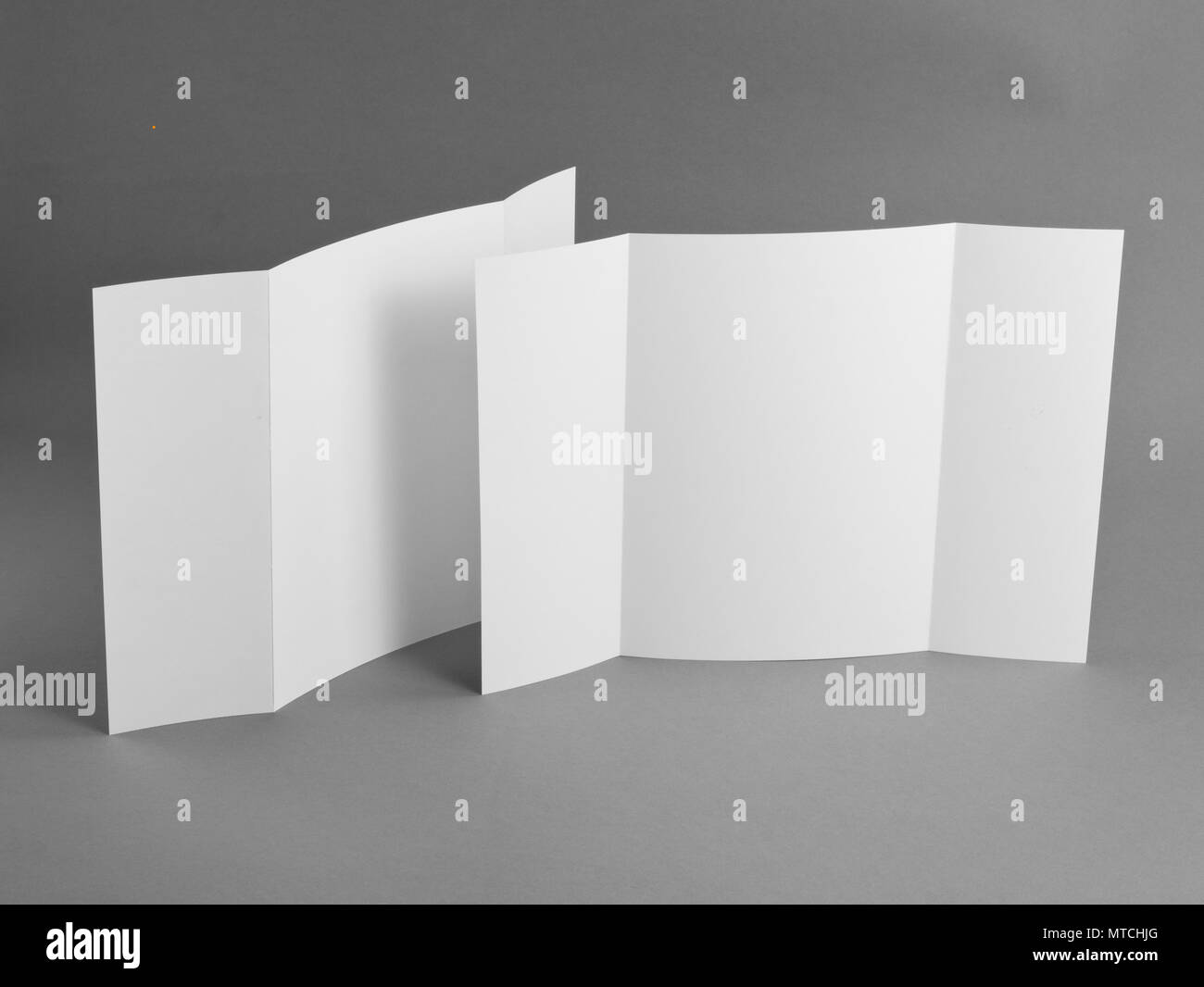 Blank gate fold brochure on grey to replace your design Stock Photo - Alamy
