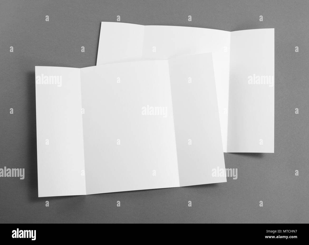 Blank gate fold brochure on grey to replace your design Stock Photo - Alamy