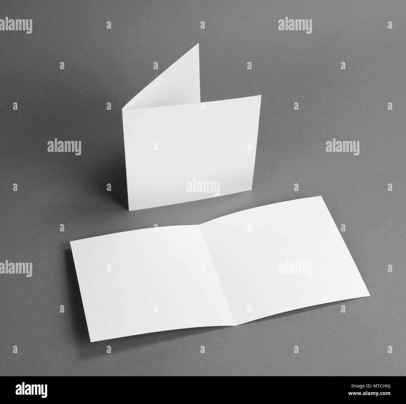 White empty closed card on grey to replace your design Stock Photo - Alamy