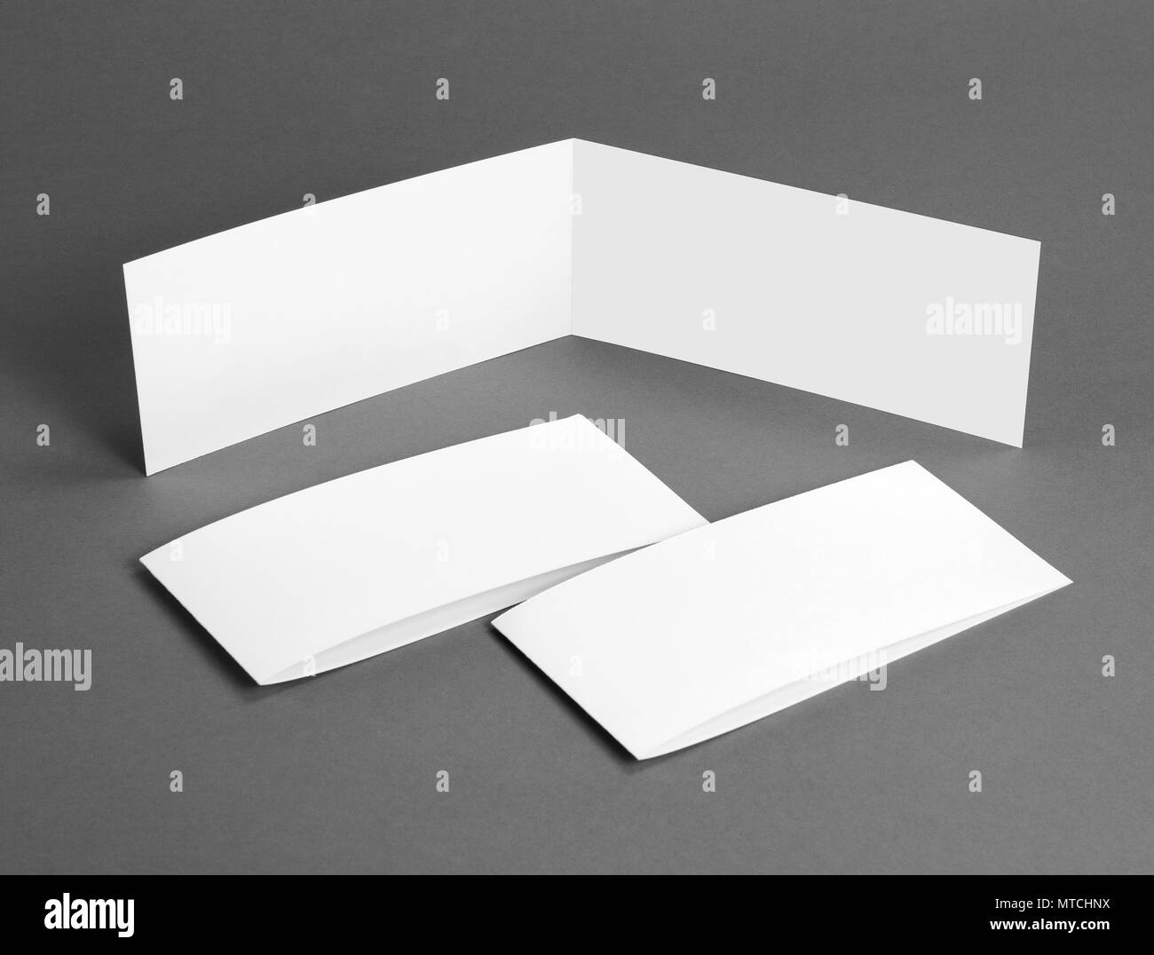 White empty closed card on grey to replace your design Stock Photo - Alamy