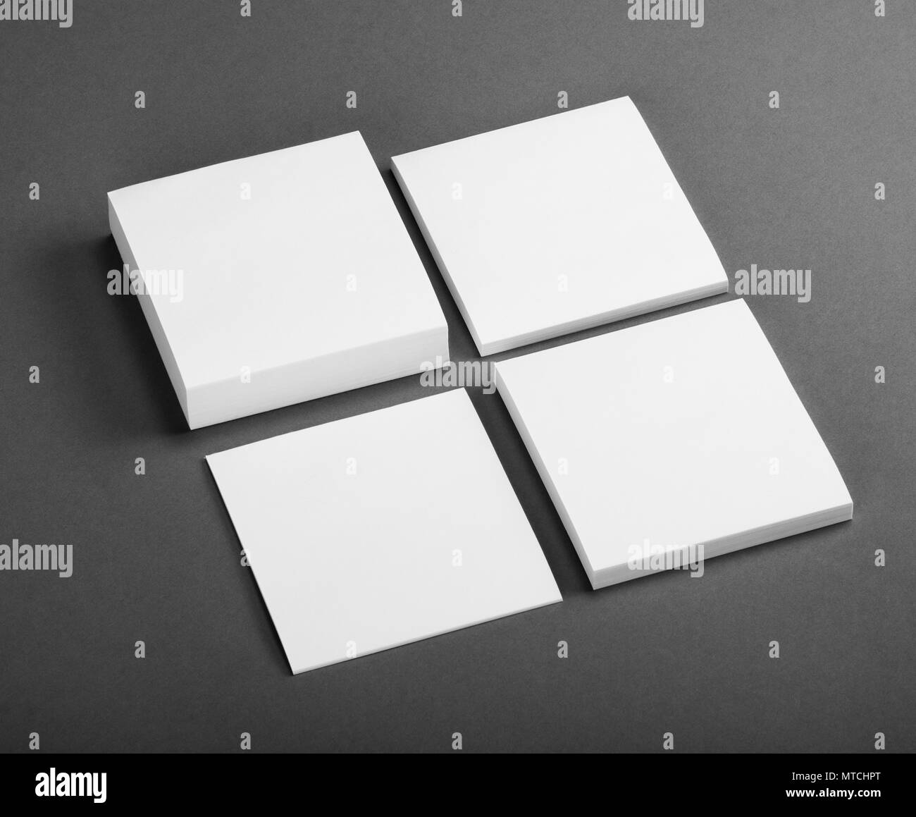 Collection of white note papers on gray background Stock Photo - Alamy