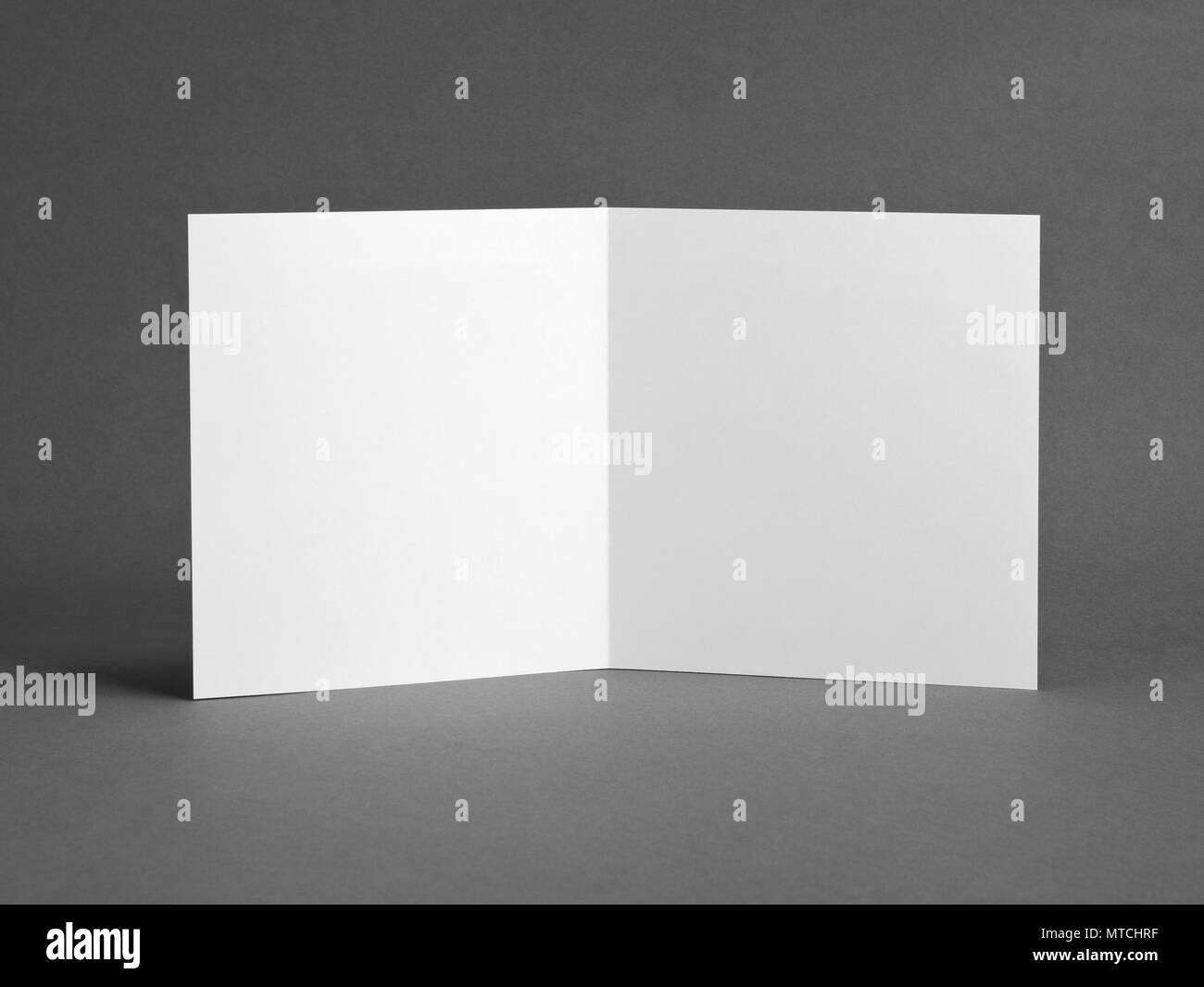 White empty card on grey to replace your design Stock Photo - Alamy