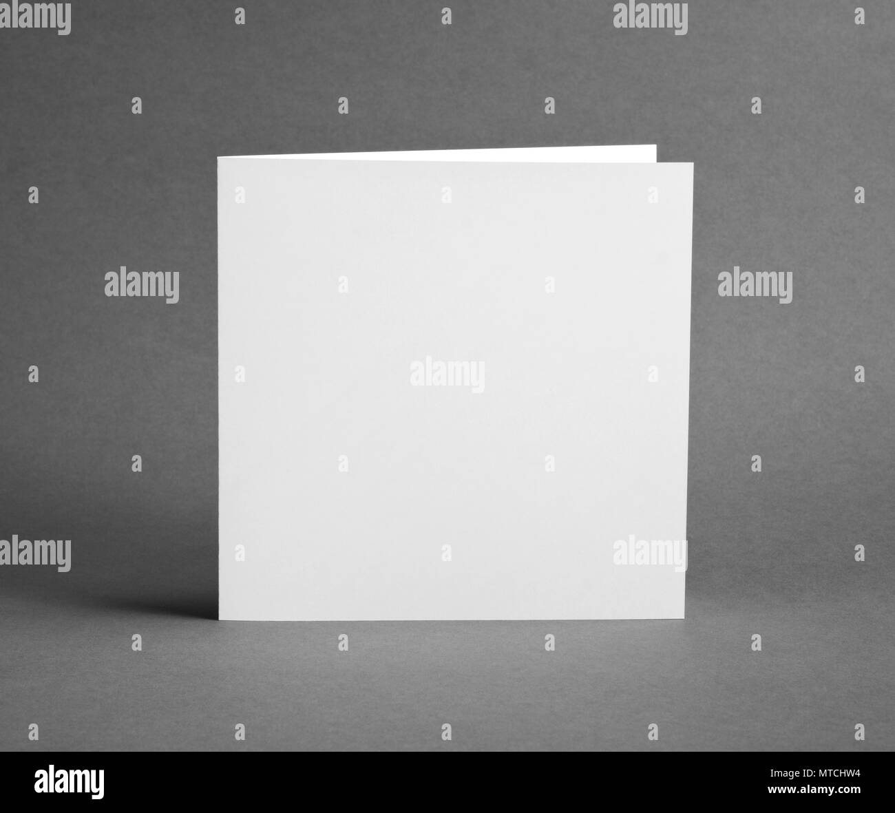 White empty closed card on grey to replace your design Stock Photo - Alamy
