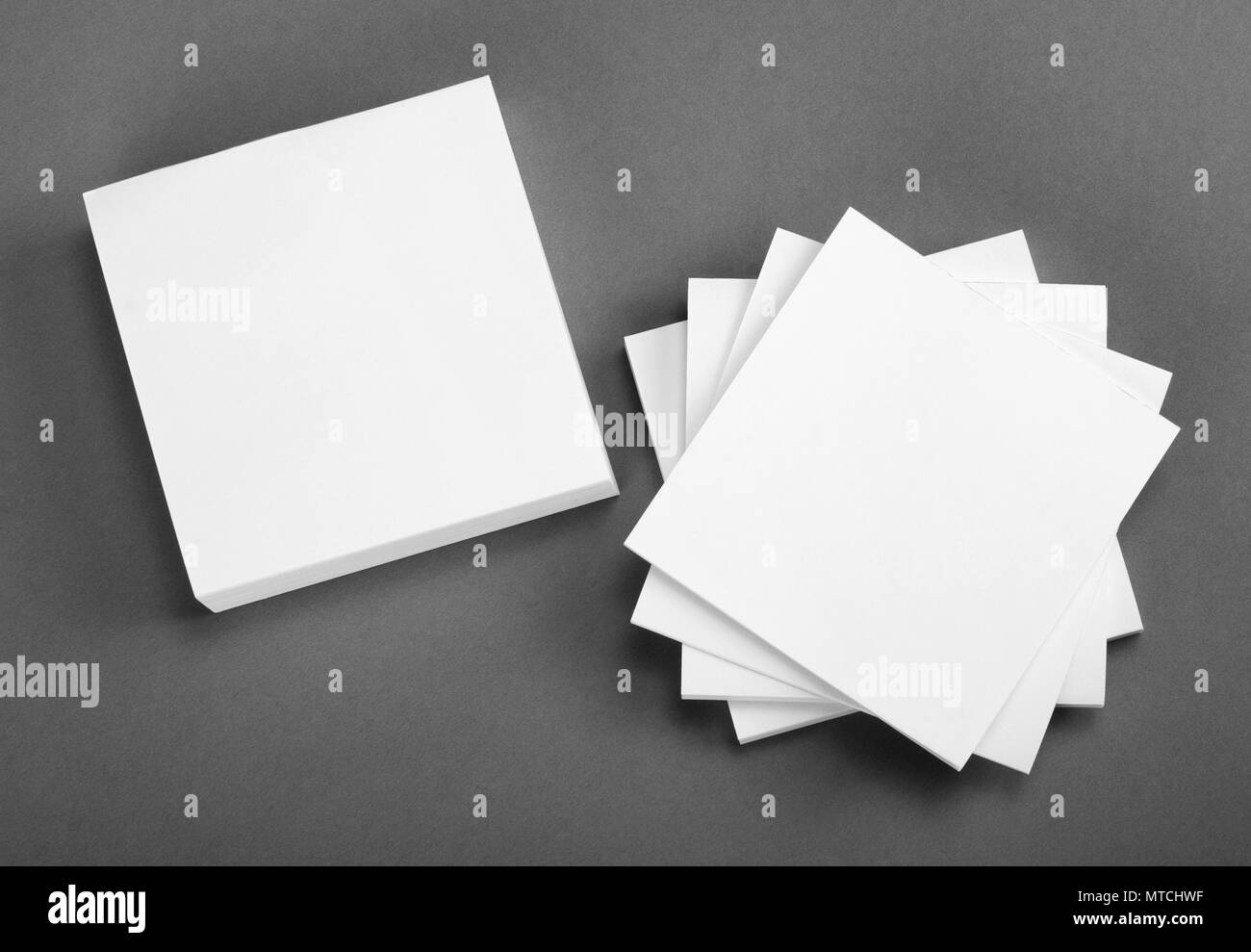 Collection of white note papers on gray background Stock Photo - Alamy