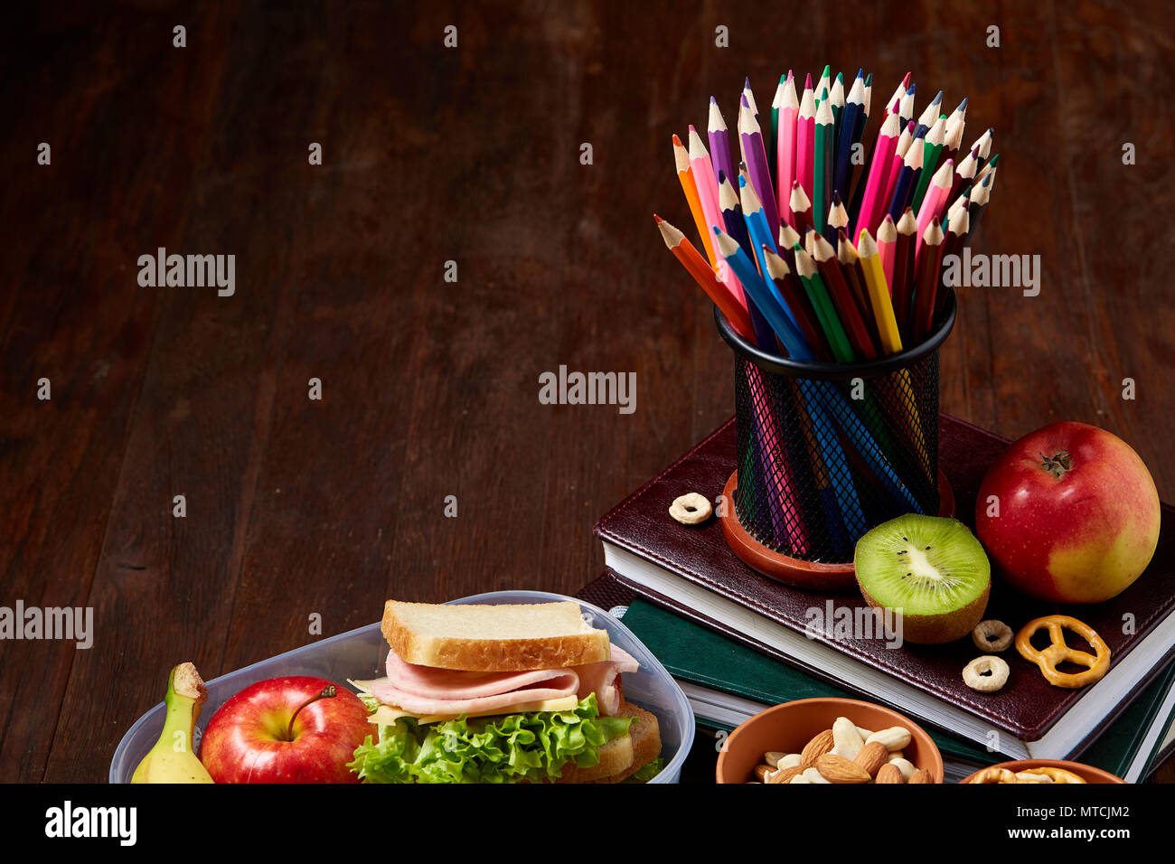 Concept of school lunch break with healthy lunch box full of sandwiches ...