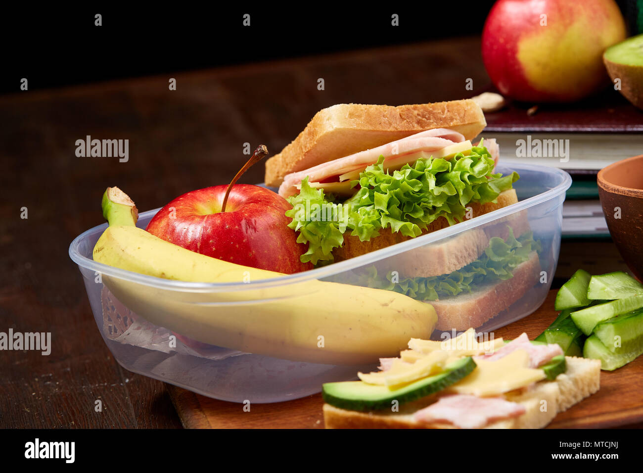 Concept of school lunch break with healthy lunch box full of sandwiches ...