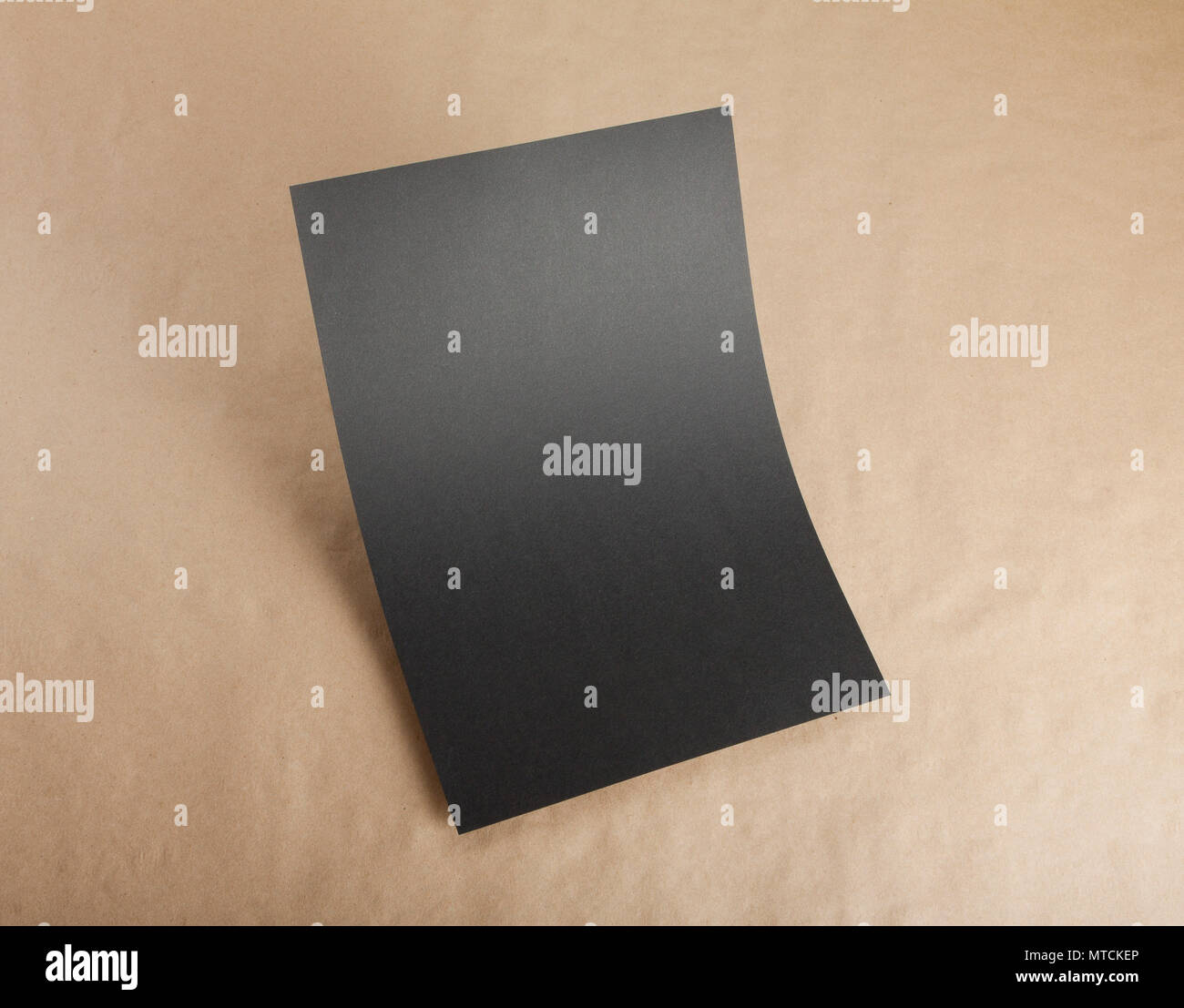 Blank flyer poster on cardboard to replace your design Stock Photo - Alamy