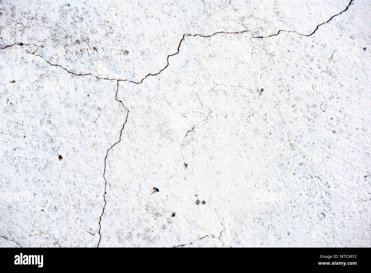 Old cracked plaster wall with lines of broken plastering due to age and ...