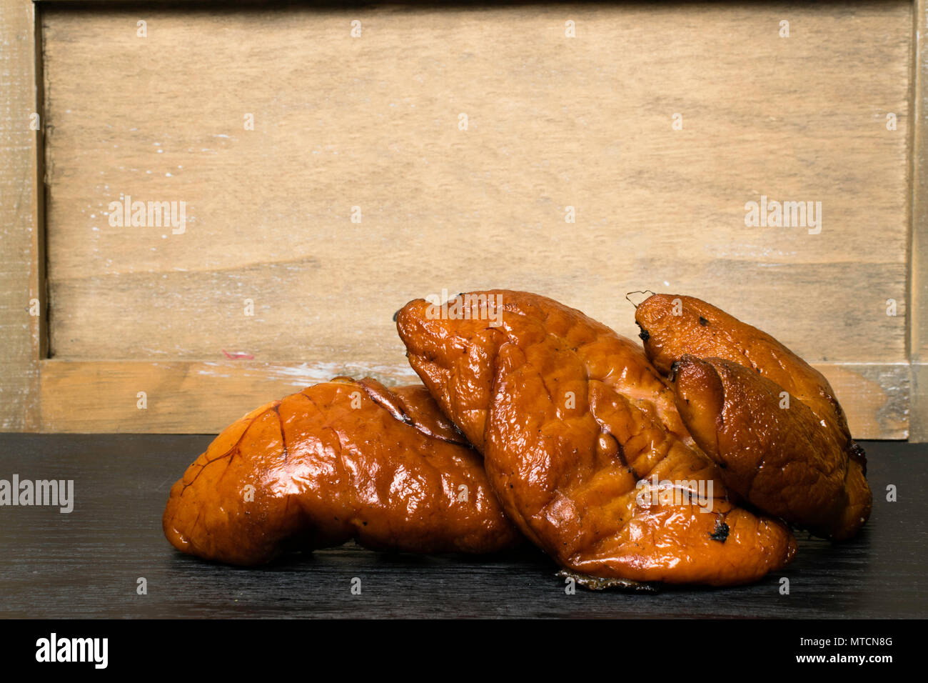 raw smoked cod caviar in wooden background Stock Photo - Alamy
