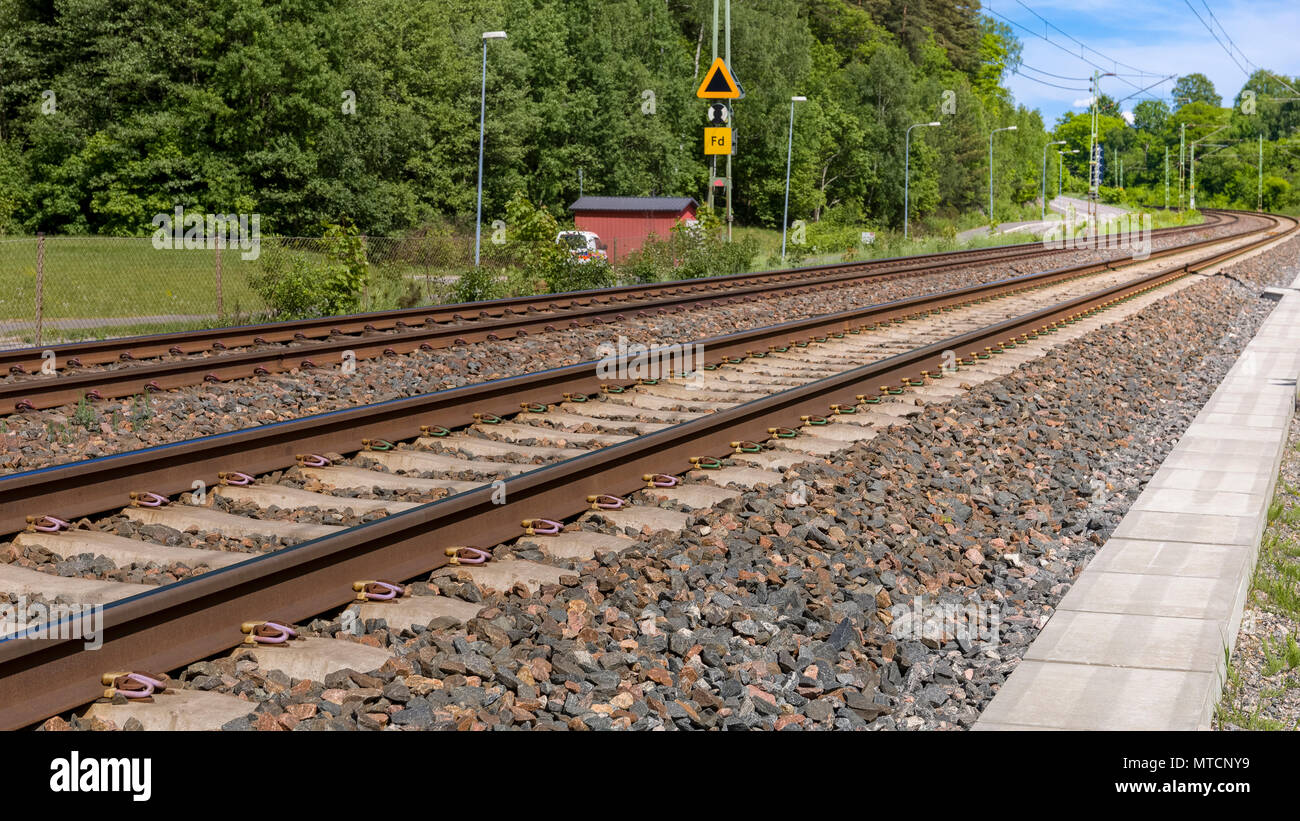 Close up view of railroad or railway track leading off into the ...