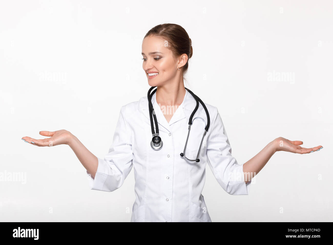 doctor showing choice between two objects Stock Photo - Alamy