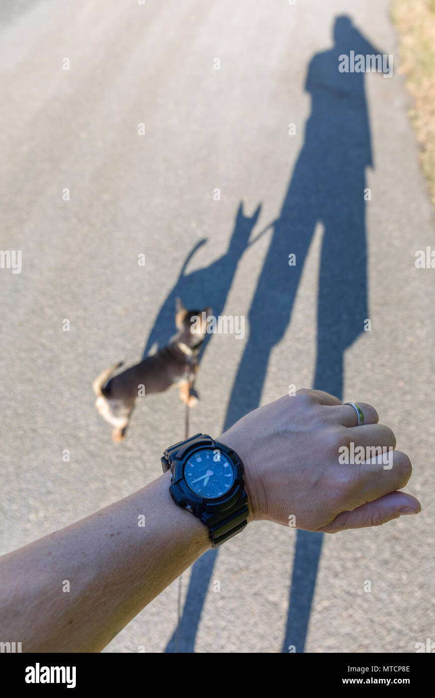 Checking the time on his watch hi-res stock photography and images - Alamy