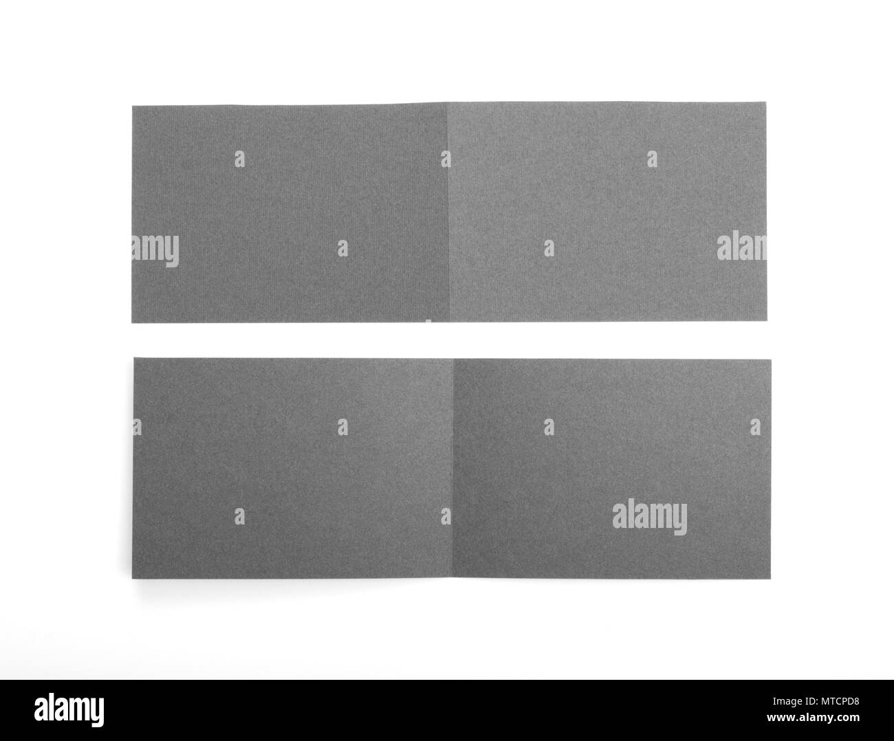 Blank two-fold flyers or leaflets on white Stock Photo - Alamy