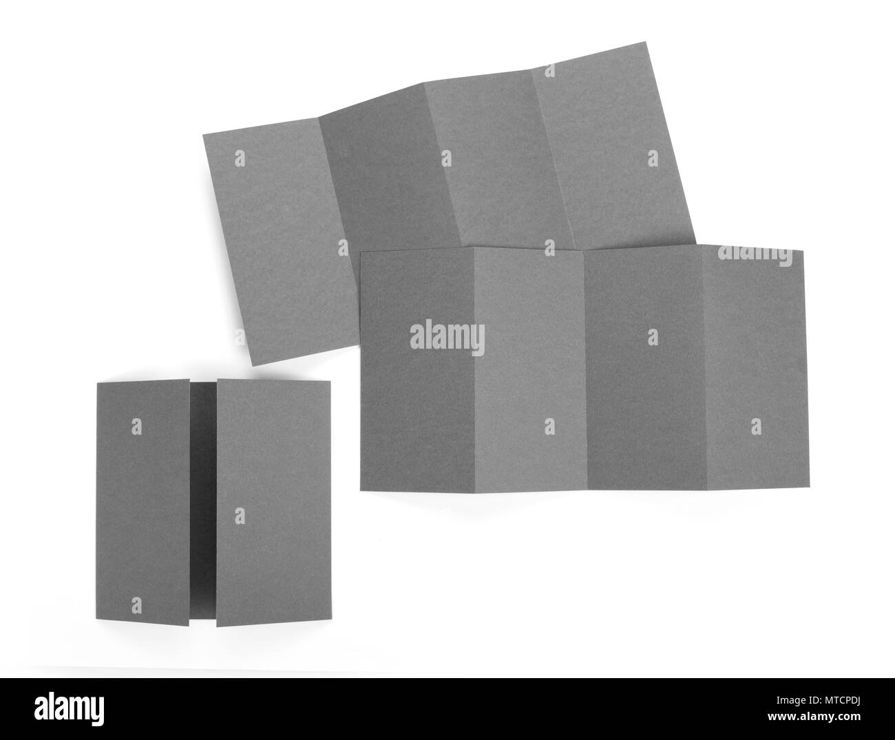 Blank folded paper leaflet or flyer mockup Stock Photo - Alamy