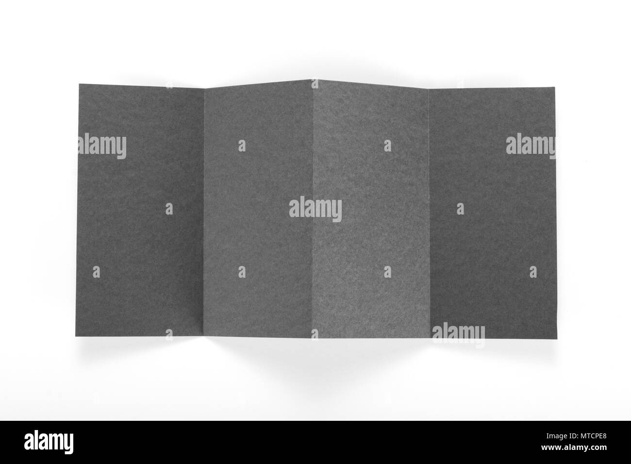Blank folded paper leaflet or flyer mockup Stock Photo - Alamy
